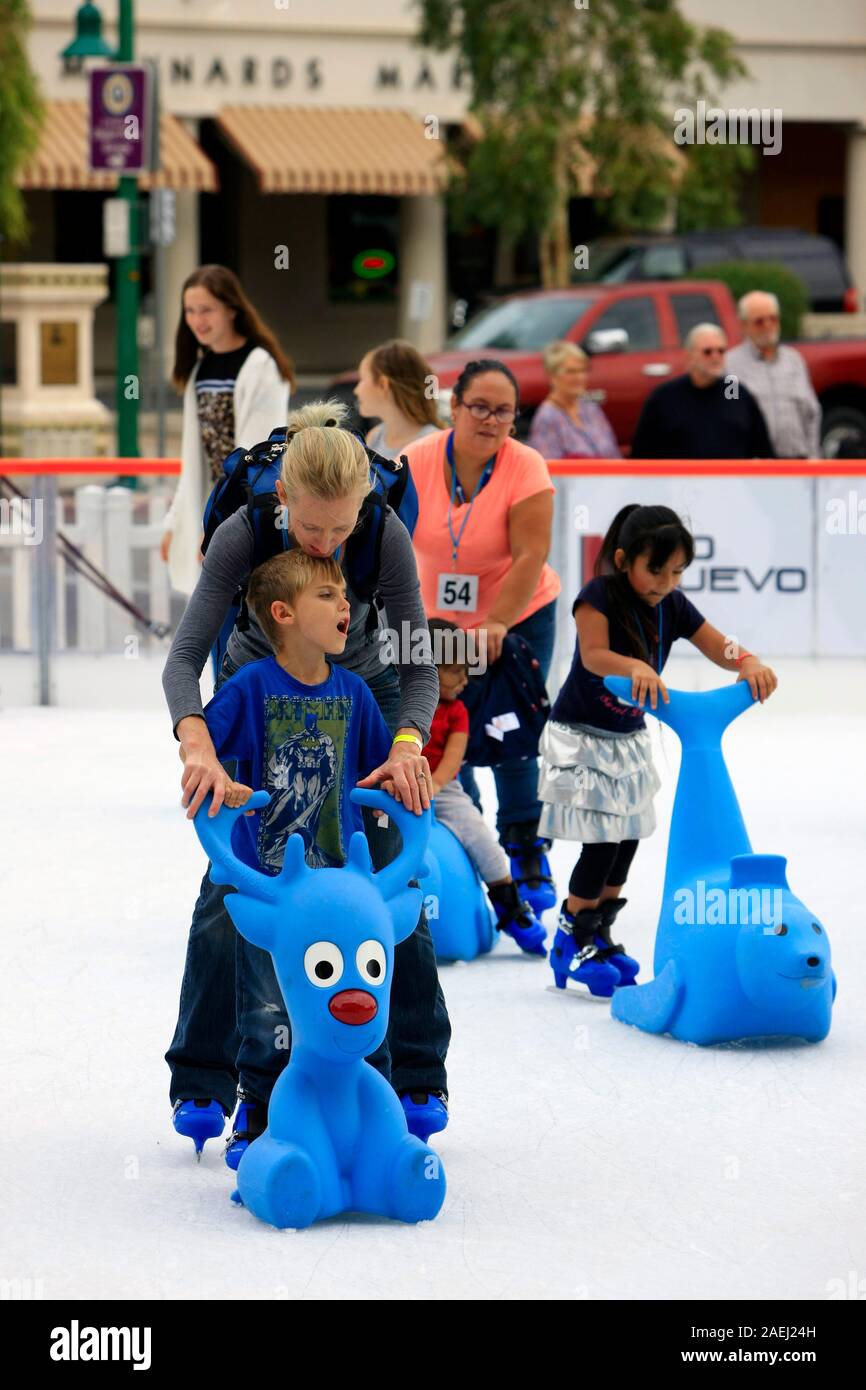 People enjoying the outdoor ice skating rink in downtown Tucson AZ ...