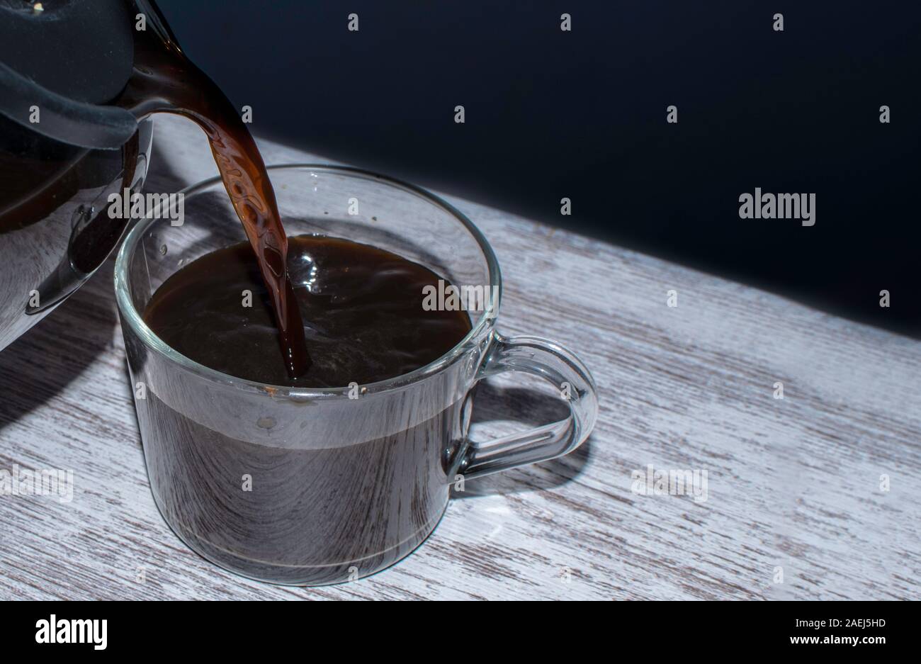 cup of coffee, filling directly from the coffee maker Stock Photo - Alamy