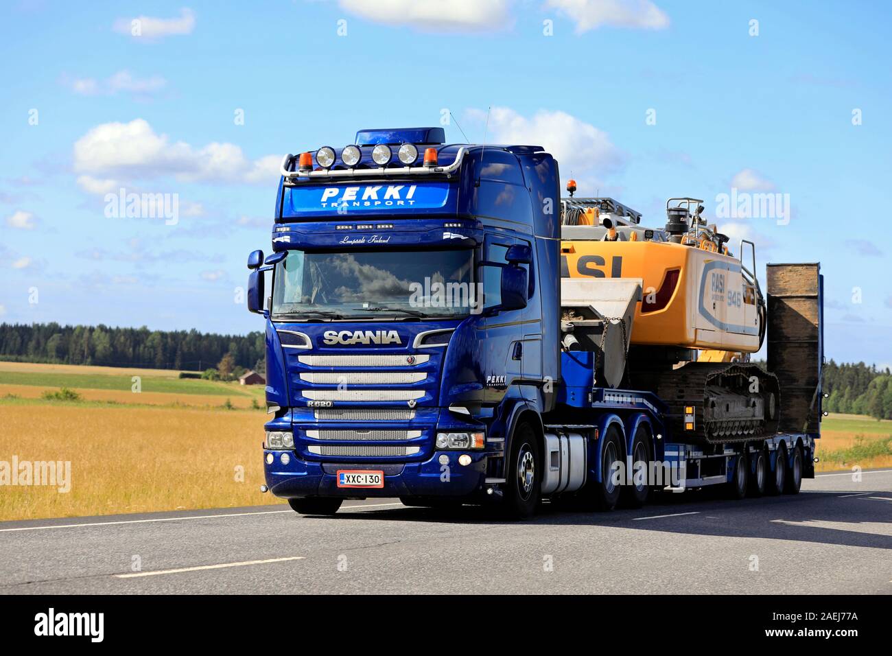 Blue Scania R620 truck of Pekki Transport Oy transports RASI 946 ...