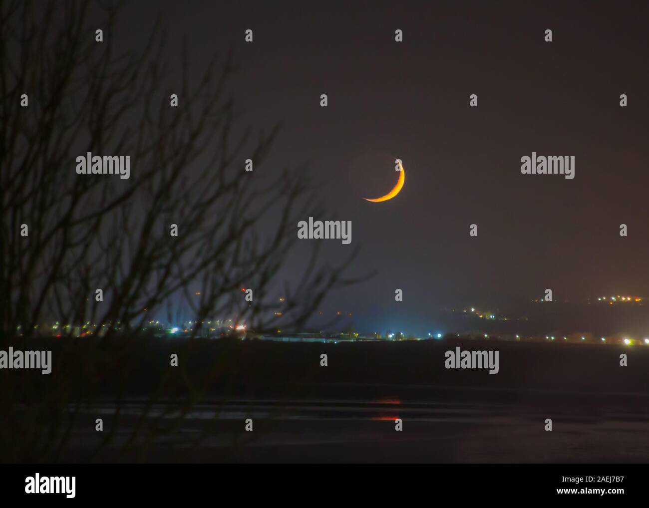 New moon setting over Sandwich Bay, Kent Stock Photo - Alamy