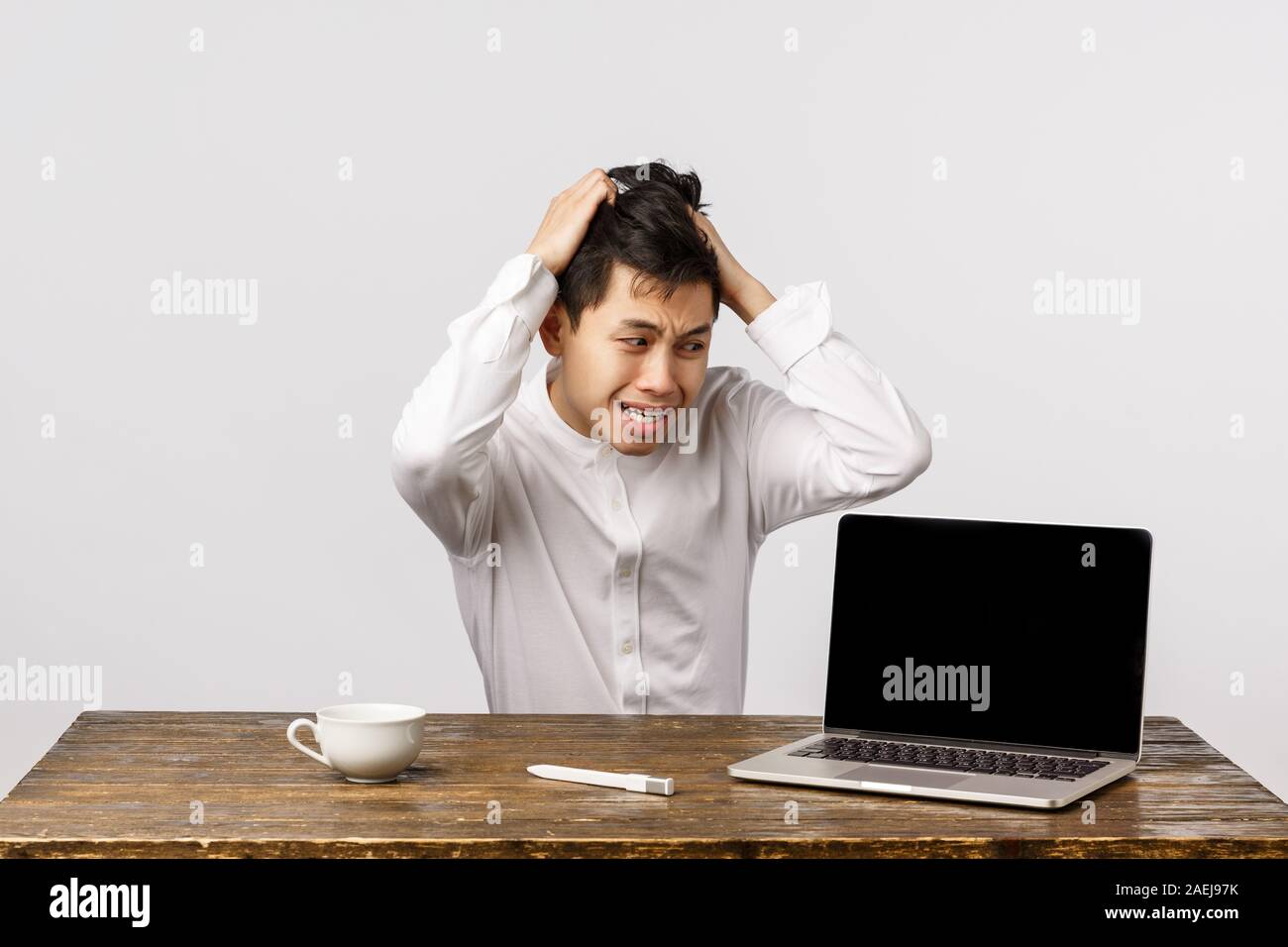 Pulling hair and computer hi-res stock photography and images - Alamy