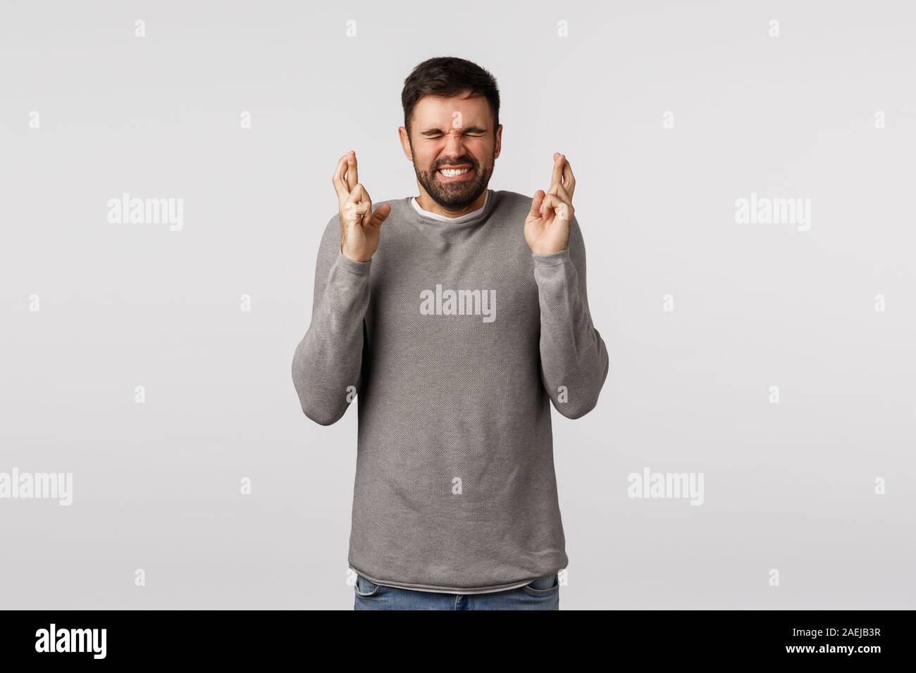 Excited and nervous bearded adult man willing win lottery, achieve ...