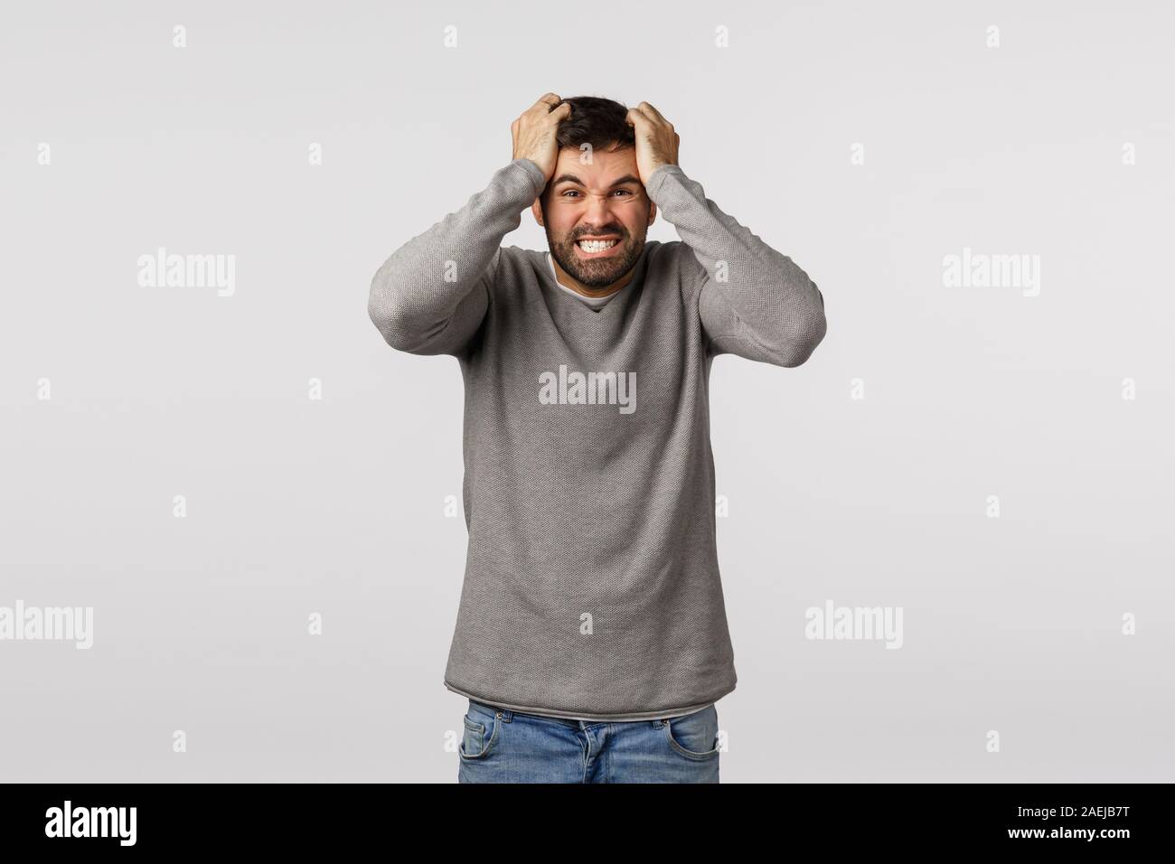 Angry and annoyed young pressured bearded man feeling anger and furious ...