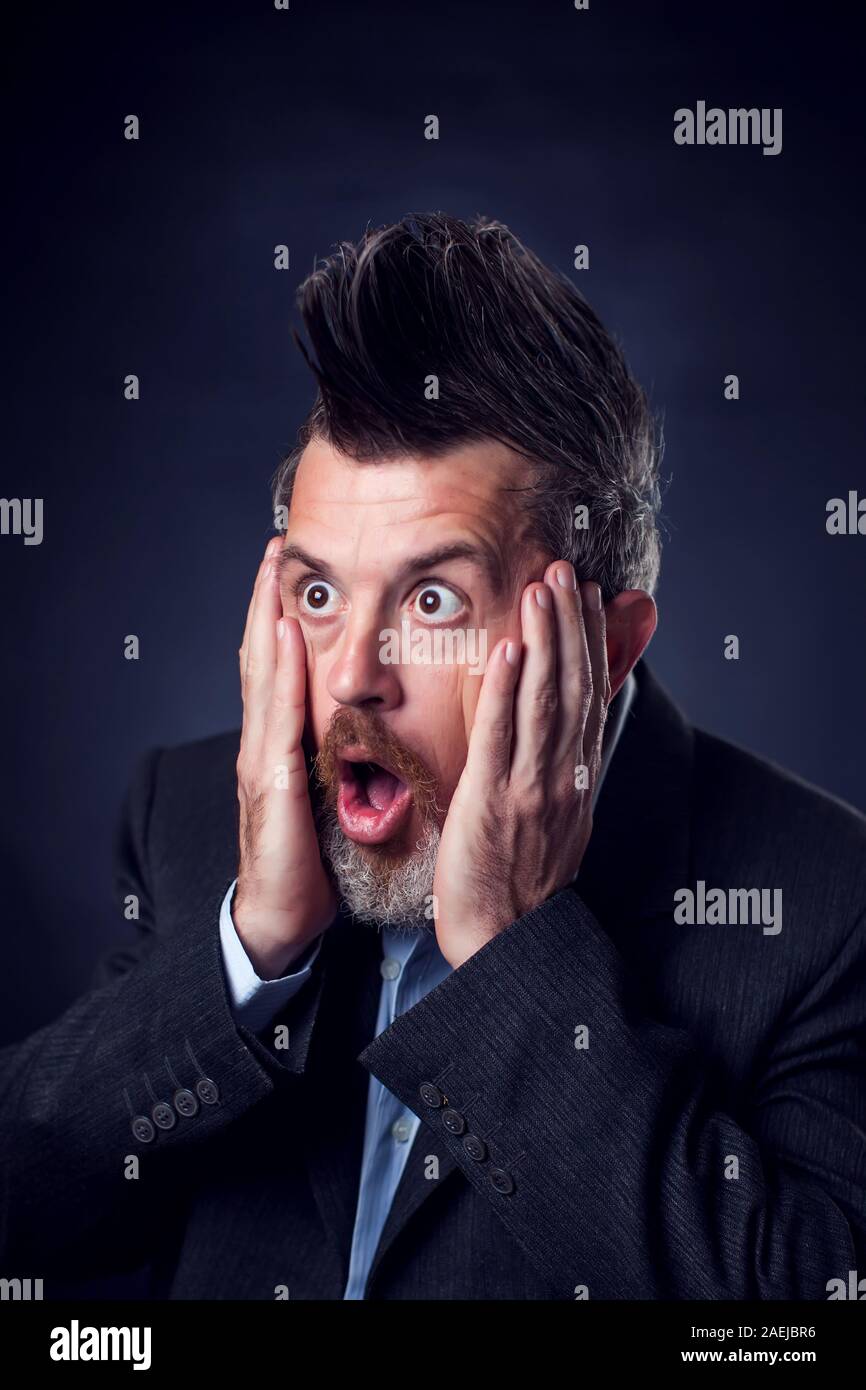 Shocked man suit hi-res stock photography and images - Alamy
