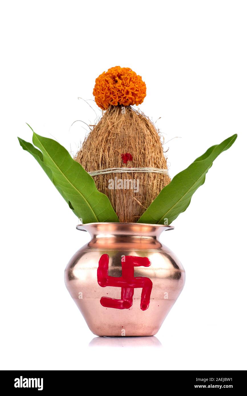 Copper Kalash with coconut and mango leaf with floral decoration on a ...