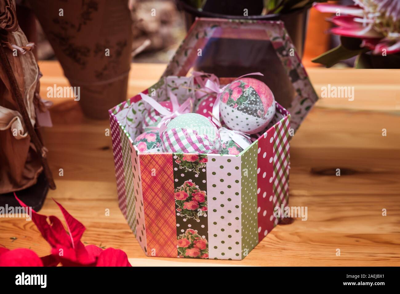 Christmas balls and other decorations inside a cardboard box to ...