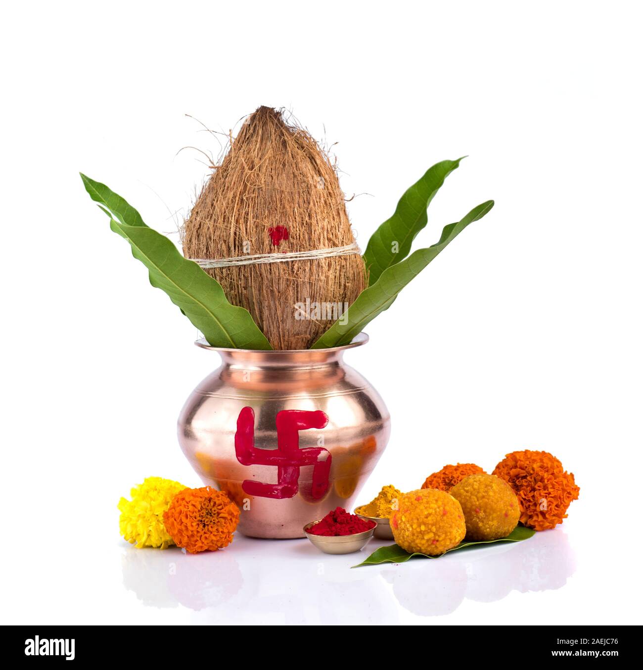 Copper Kalash with coconut, mango leaf, Haldi, kumkum and sweets with ...