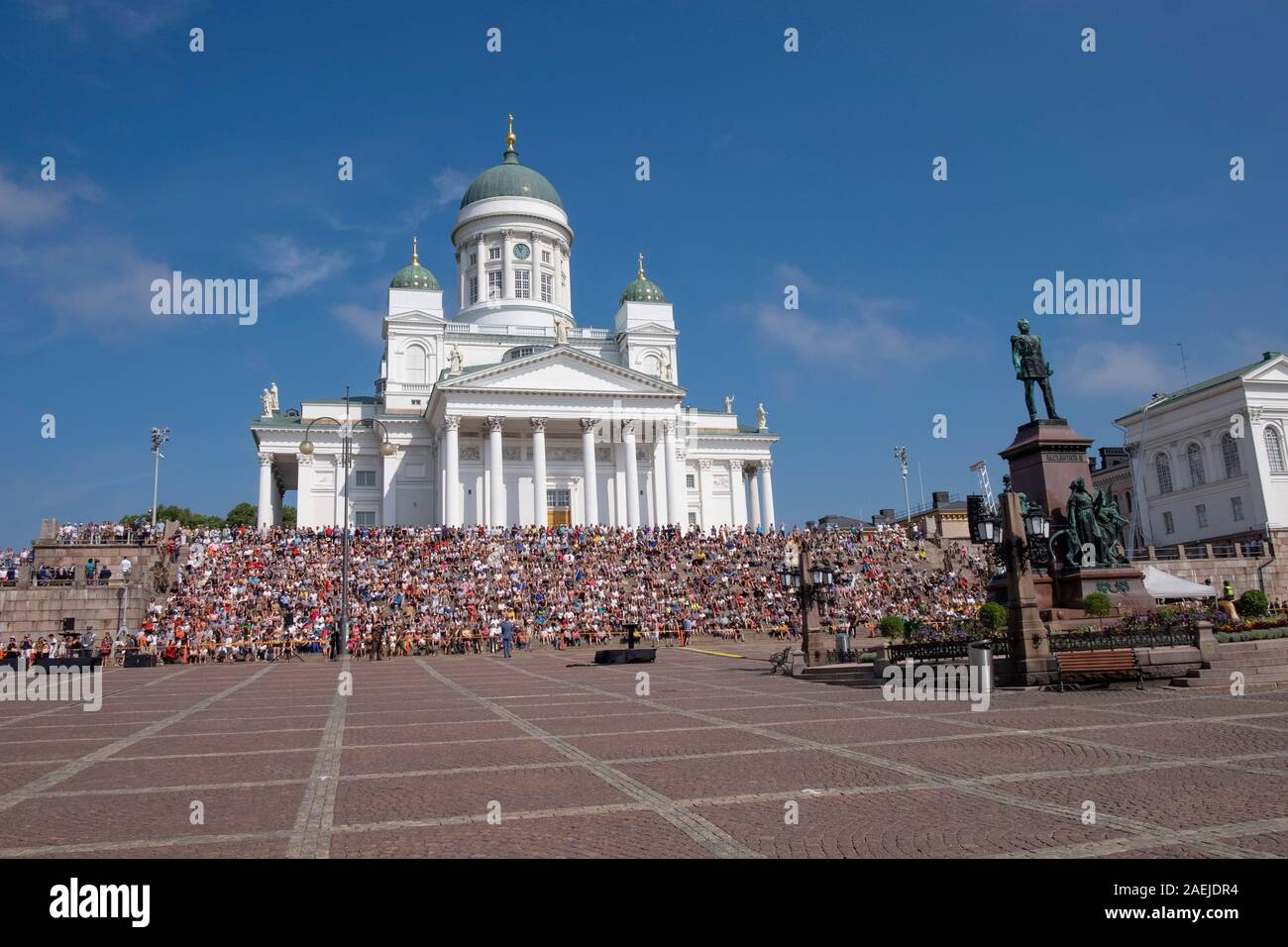 View across Senate Square of people sitting on the steps of the ...