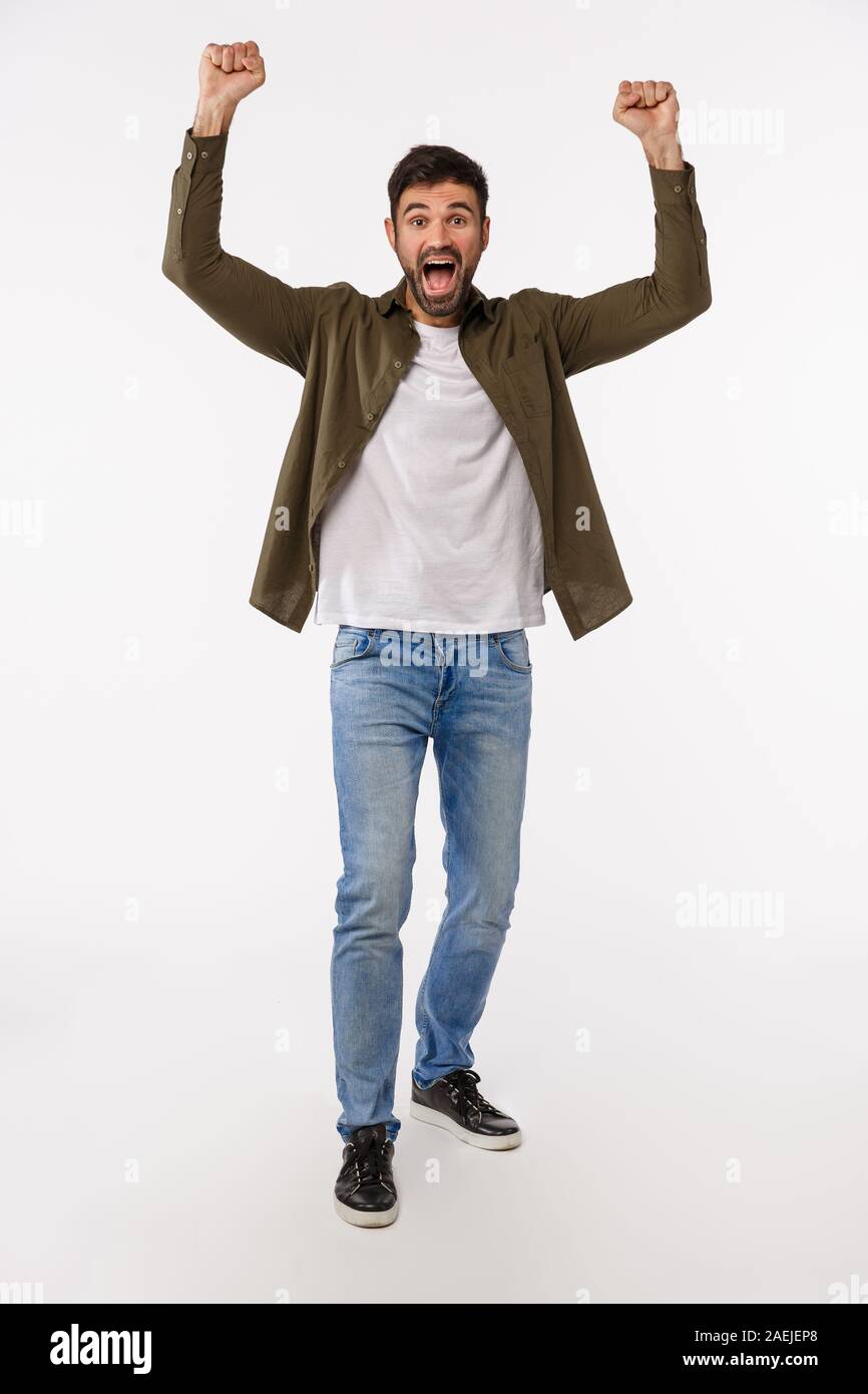 Success, achievement and victory concept. Vertical full-length shot ...