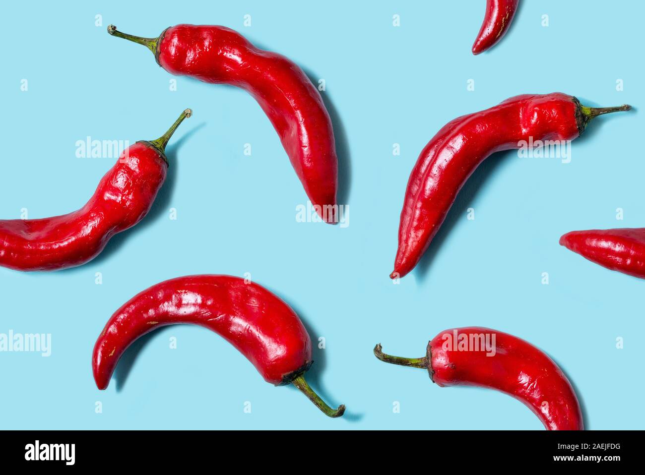 Top view of fresh chilli pepper isolated on blue background. Minimal ...