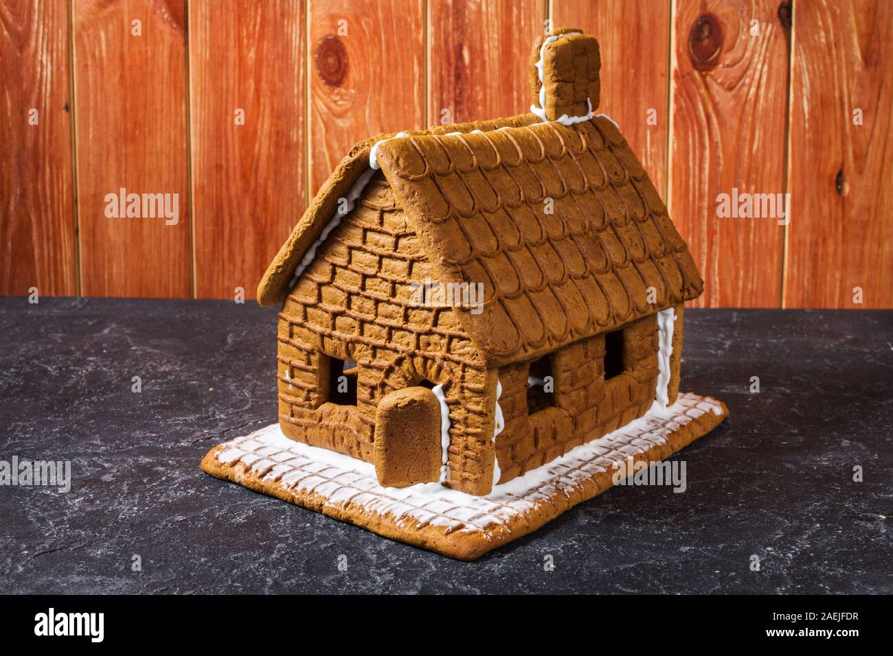 Homemade gingerbread house on brown background Stock Photo - Alamy