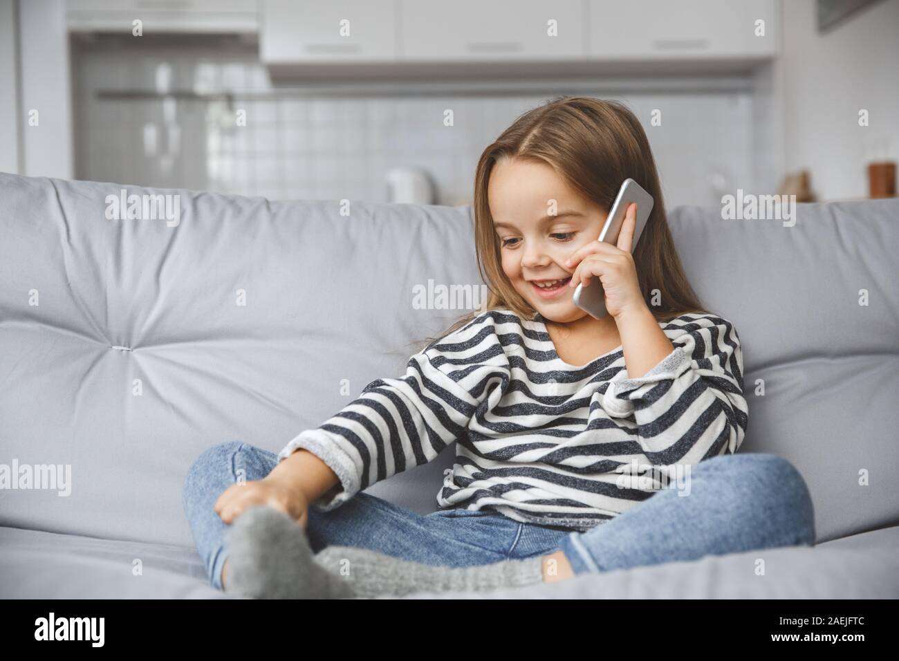 Little kid girl at home childhood concept phone call Stock Photo - Alamy