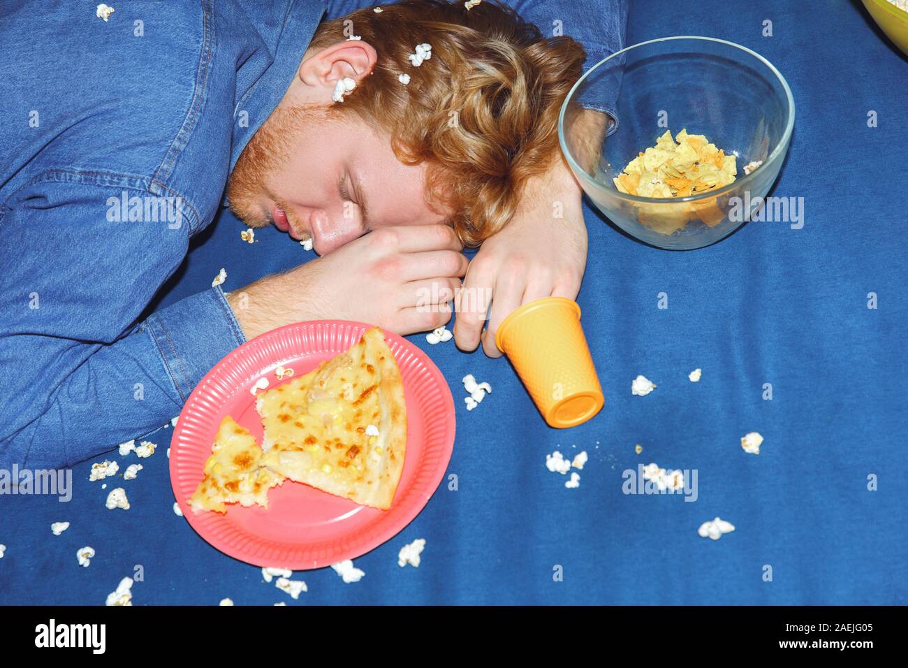 Friends having party indoors fun together guy sleeping after-party ...