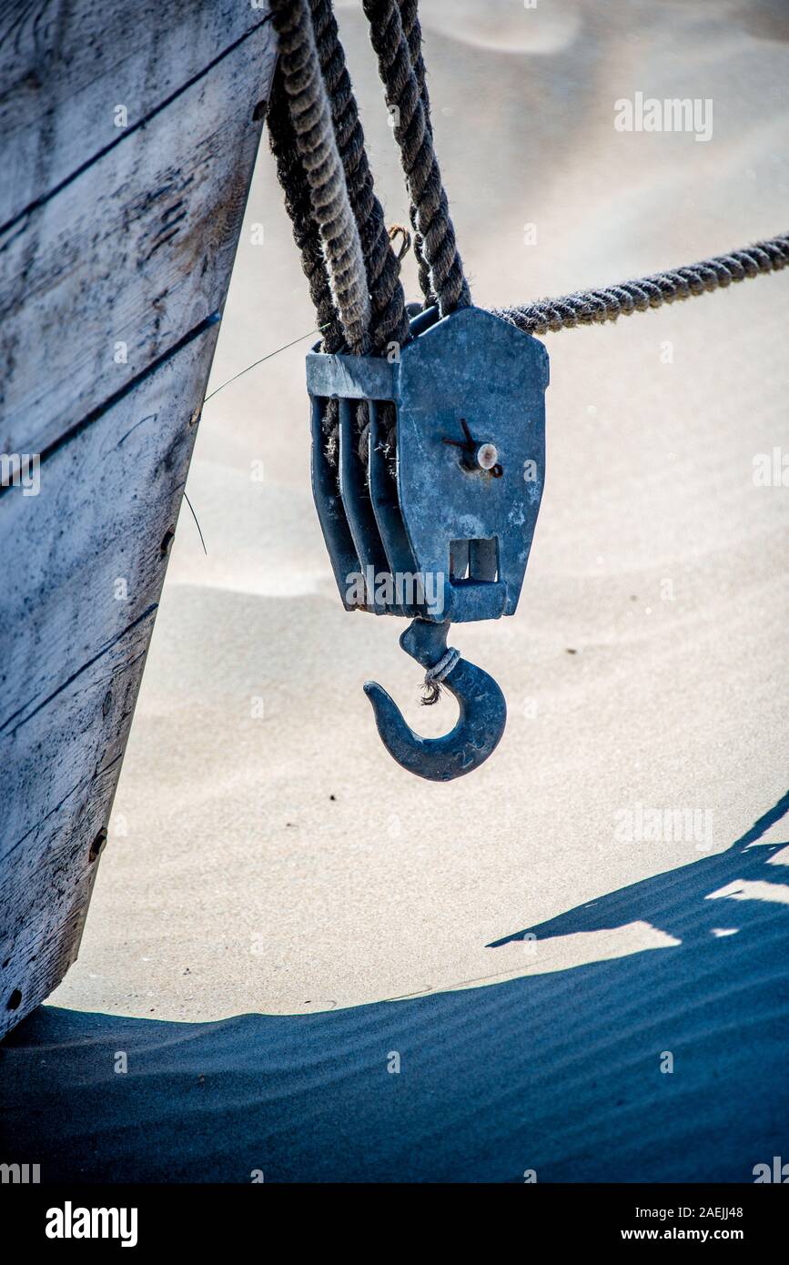 Heavy Duty Rigging Cables Hook at a boat on the beach Stock Photo - Alamy