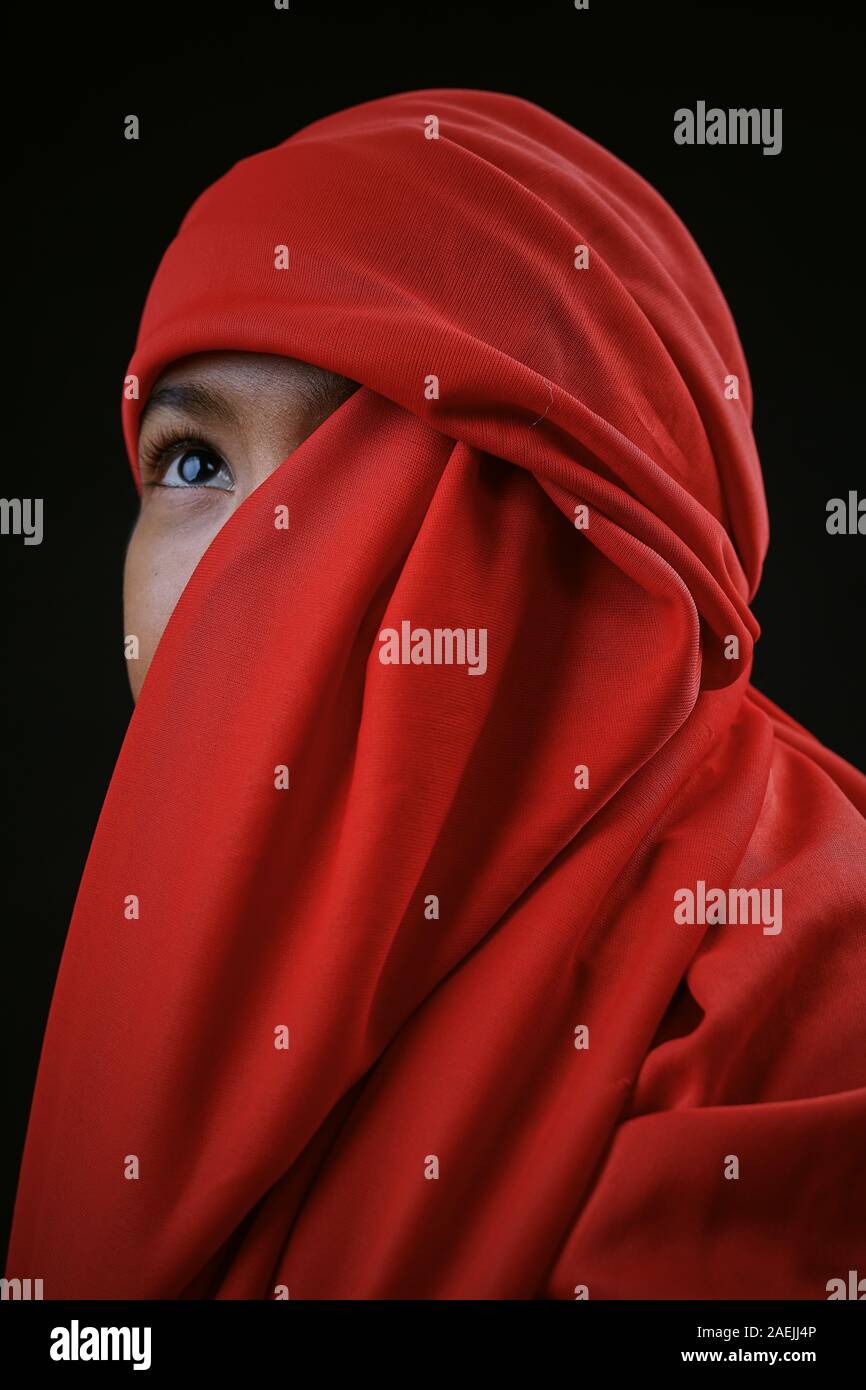 Portrait of Muslim young boy wearing red costume Stock Photo - Alamy