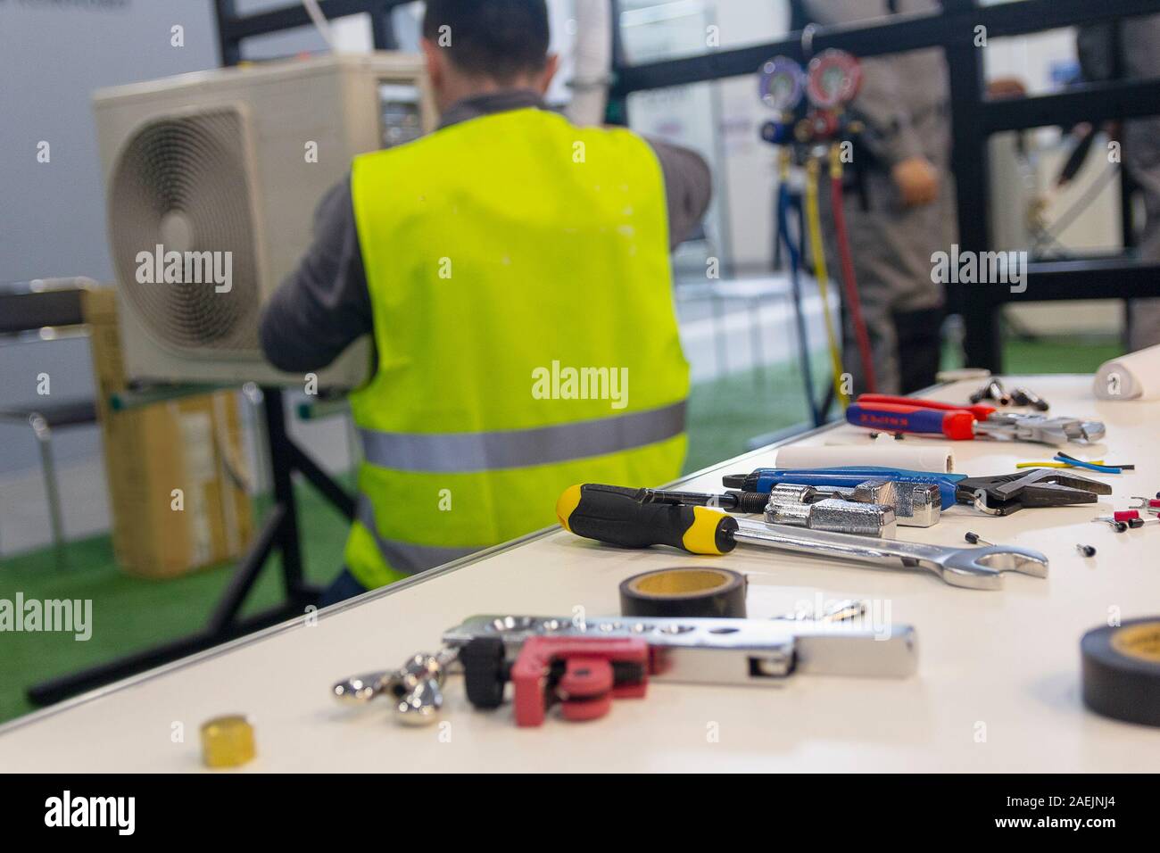 Tools and air conditioning repairman at work Stock Photo - Alamy