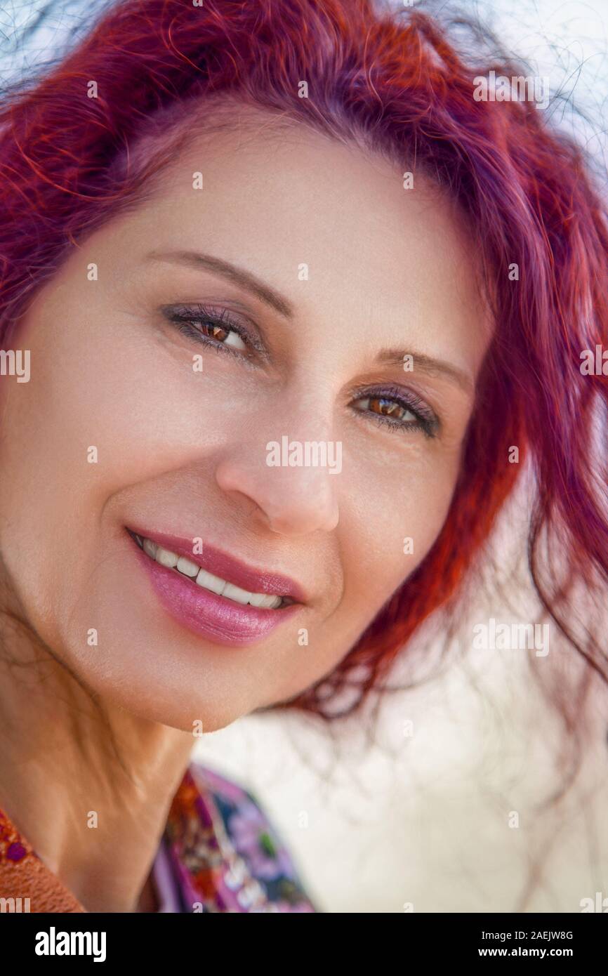 close portrait of mature woman with mediterranean facial features ...