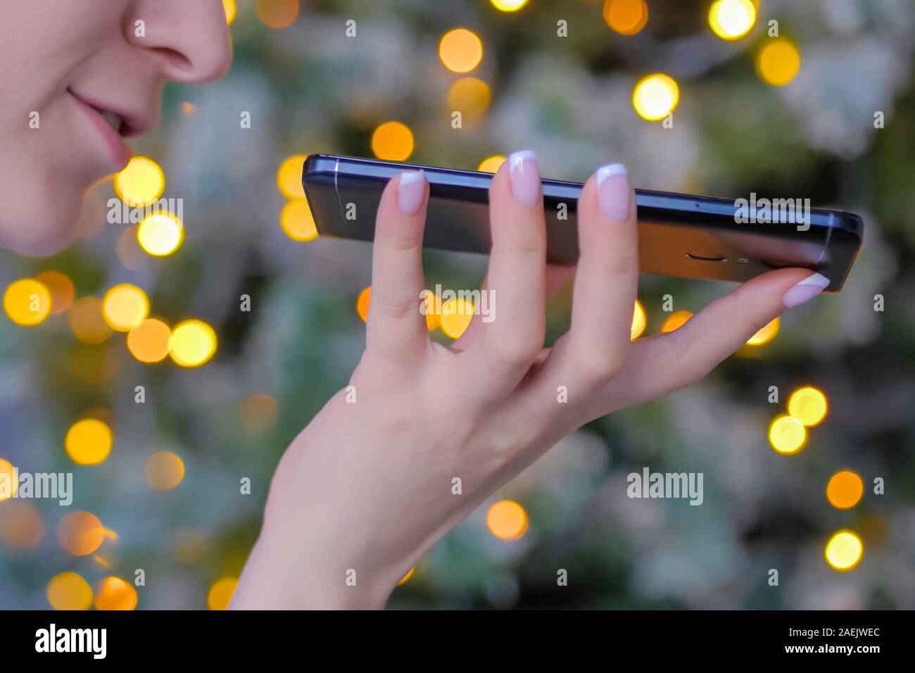 Woman recording voice message using hi-res stock photography and images ...
