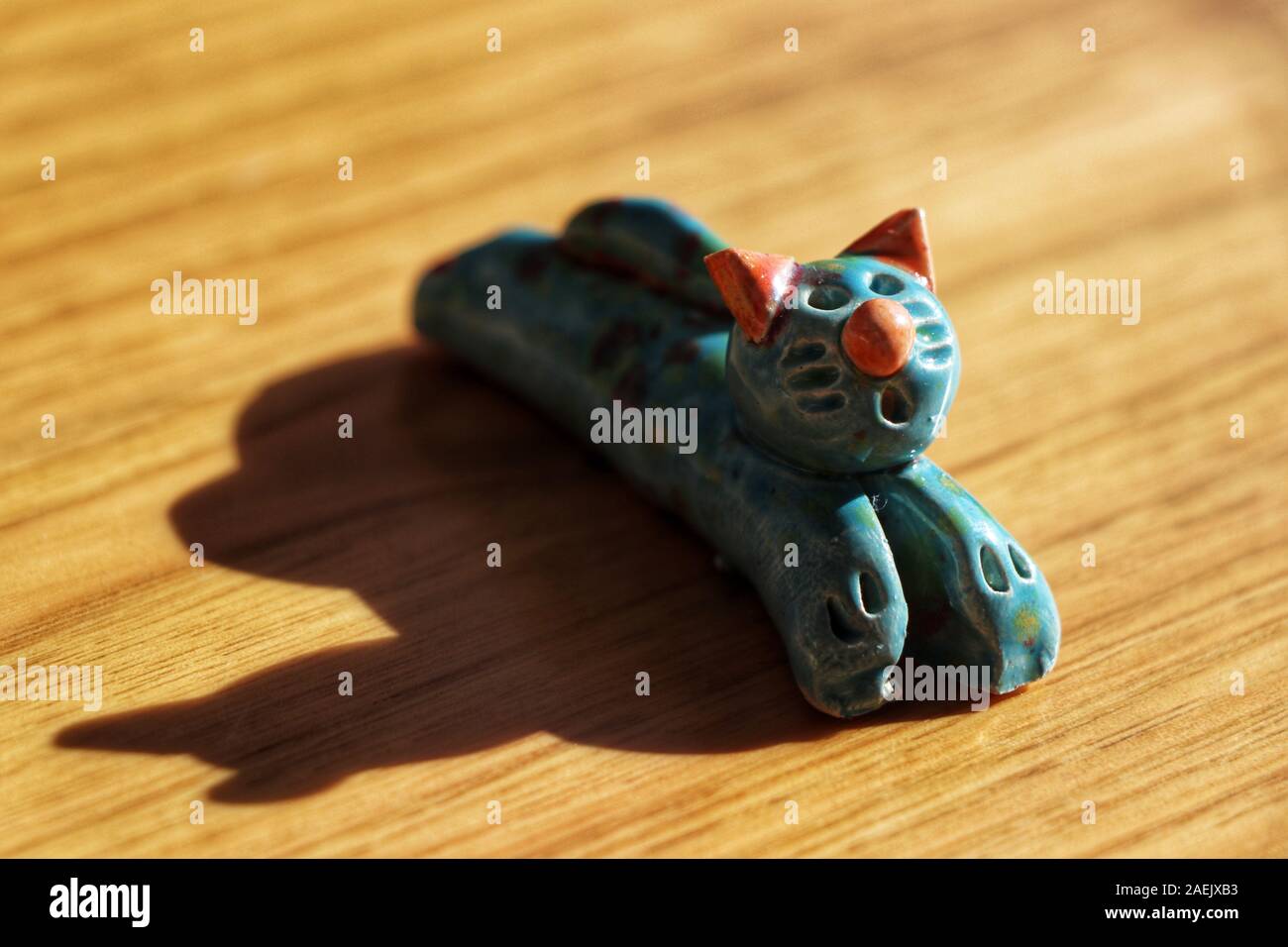 A small china cat, typical of the style of pottery from Porto, Portugal ...