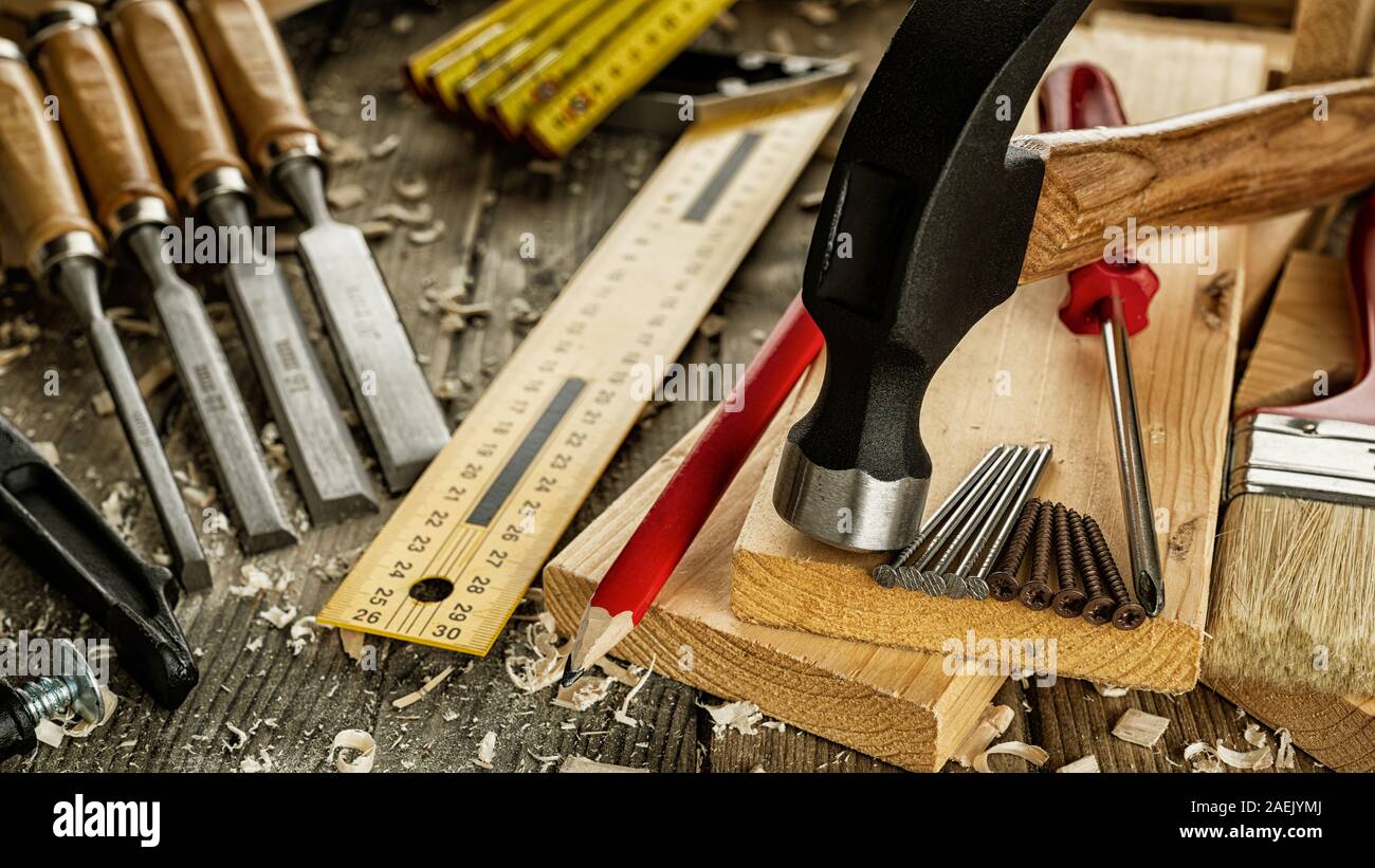 Close-up of carpenter's tools on an antique wooden table. Construction ...