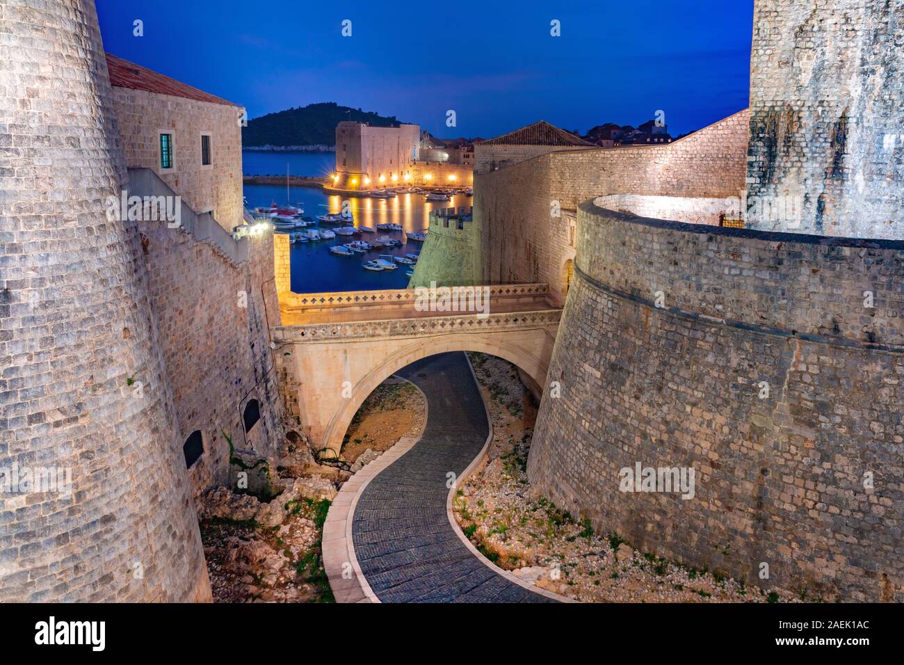 Old city walls and Old Harbour of Dubrovnik at night in Dubrovnik ...