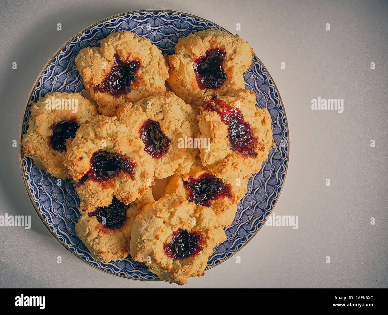 A blue plate of homemade jam buns Stock Photo - Alamy