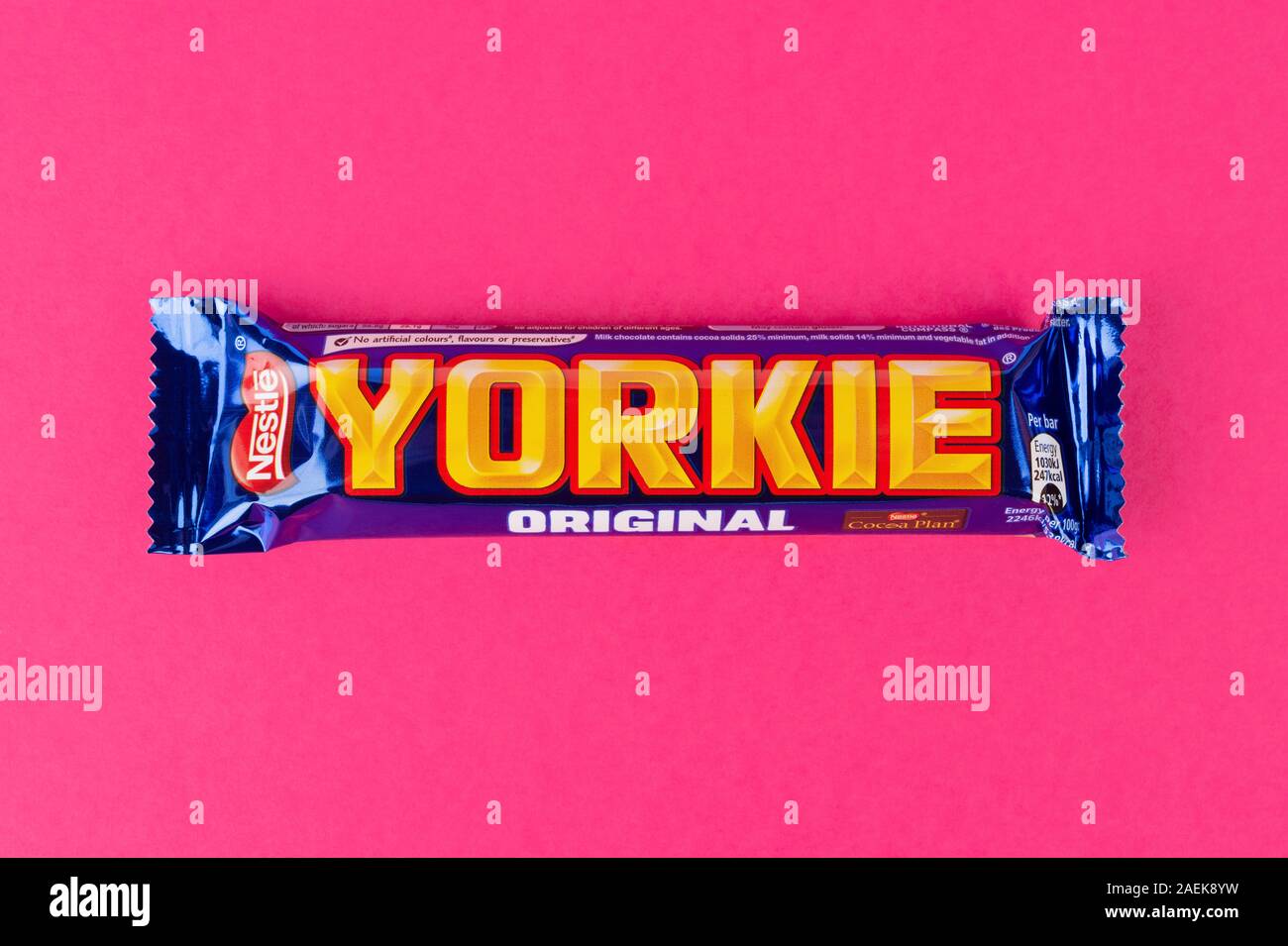 A Nestle Yorkie chocolate bar shot on a pink background Stock Photo - Alamy
