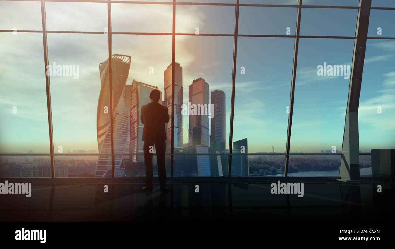 A man in a suit in the office opposite a panoramic window Stock Photo ...