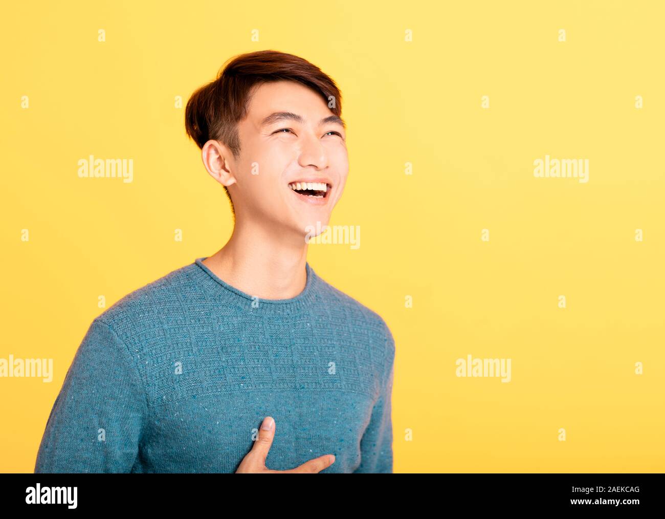 Portrait of handsome young man smiling Stock Photo - Alamy