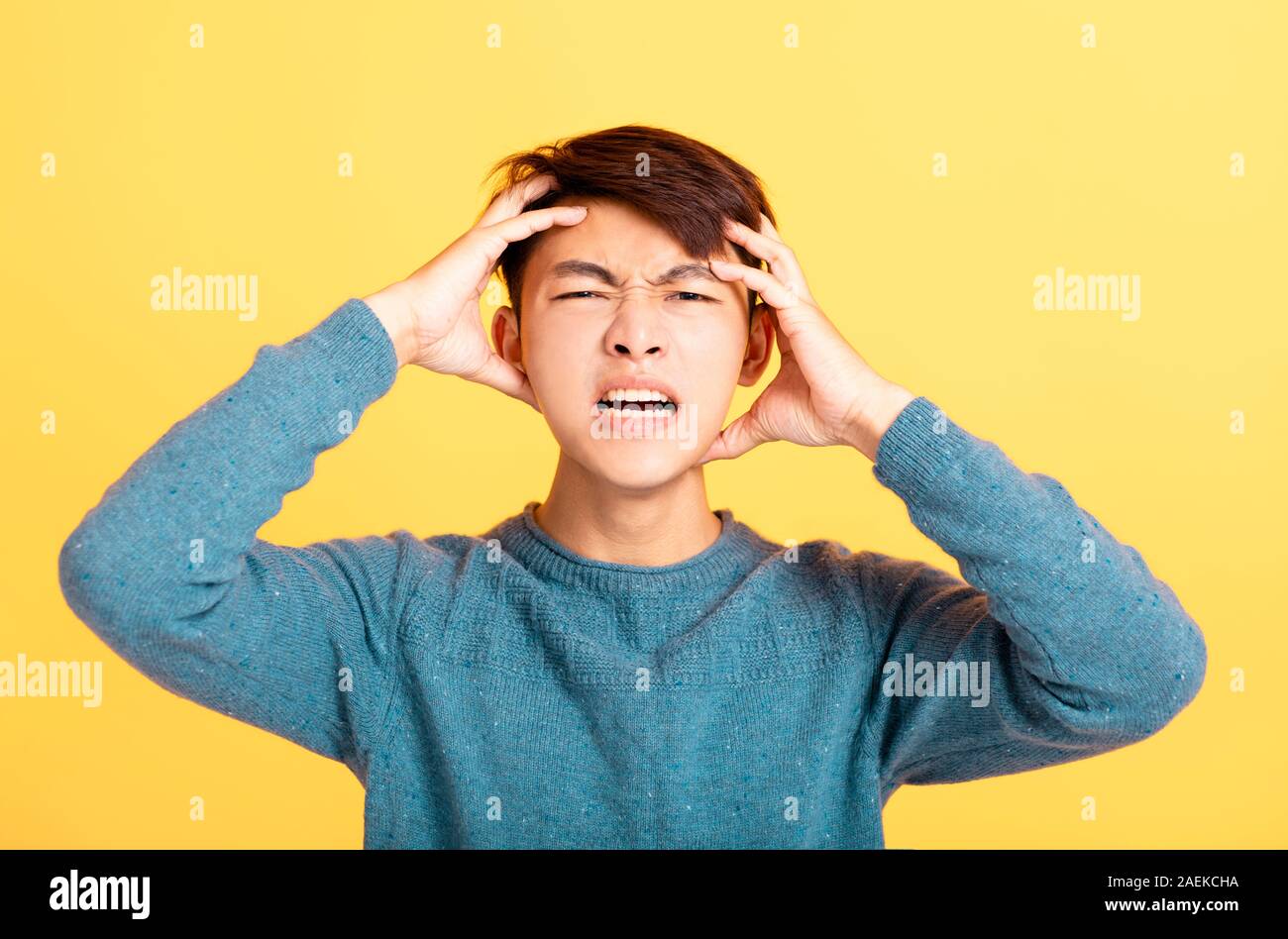 depressed man put his hands on his head Stock Photo - Alamy