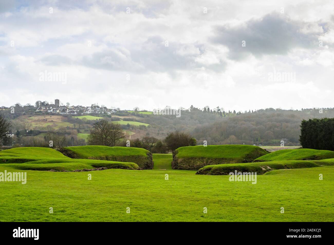 Grass covered remains of the ancient Roman amphitheatre at Caerleon ...