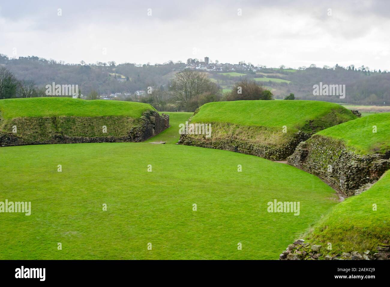 Grass covered remains of the ancient Roman amphitheatre at Caerleon ...
