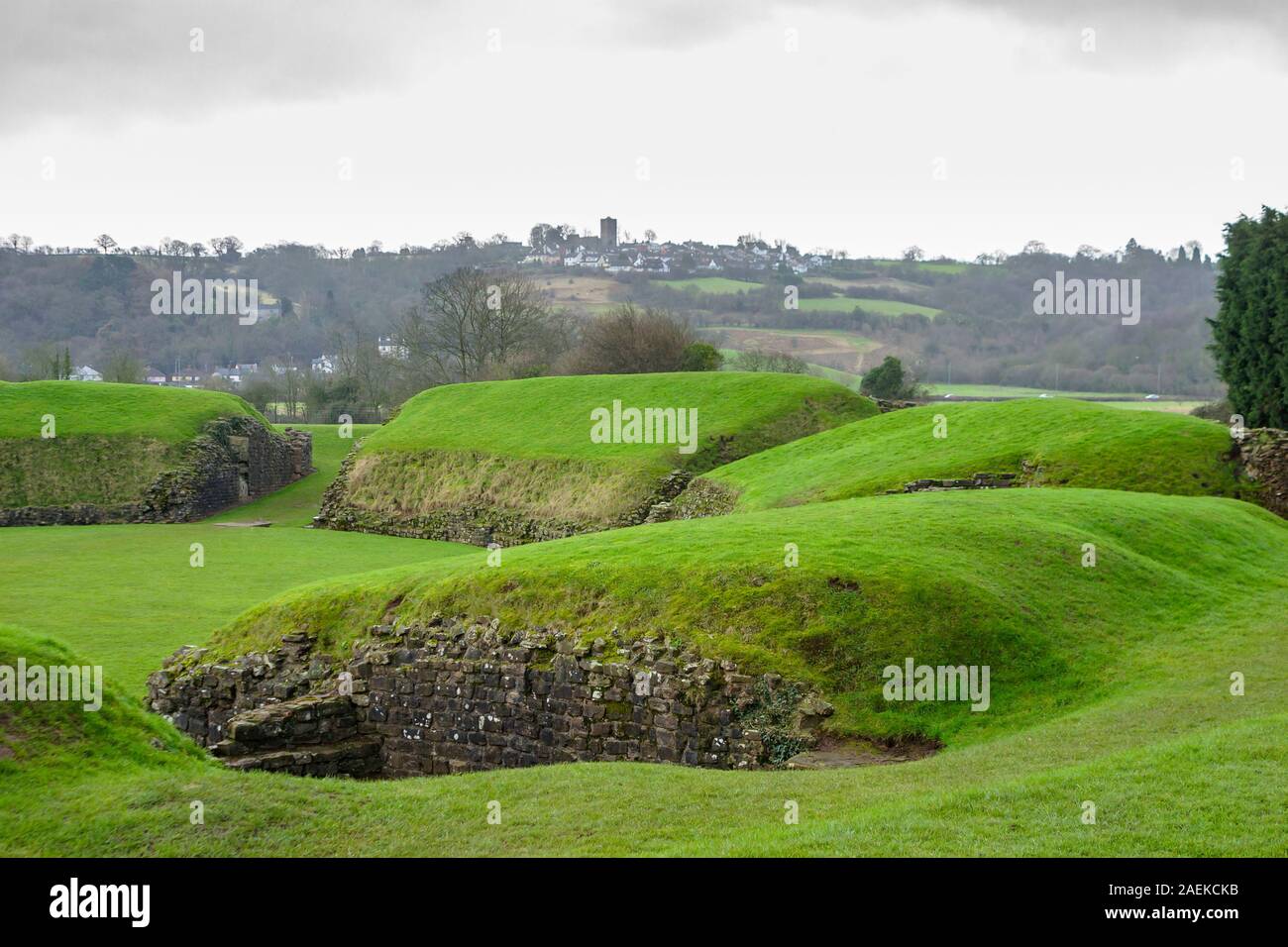 Grass covered remains of the ancient Roman amphitheatre at Caerleon ...