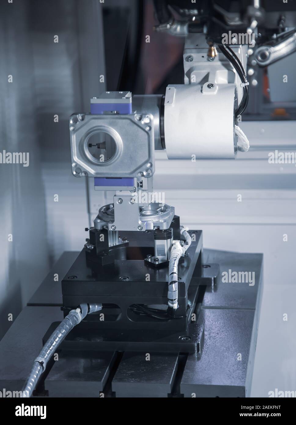 Robotic loading workpiece to compact CNC lathe sliding headstock Stock Photo - Alamy