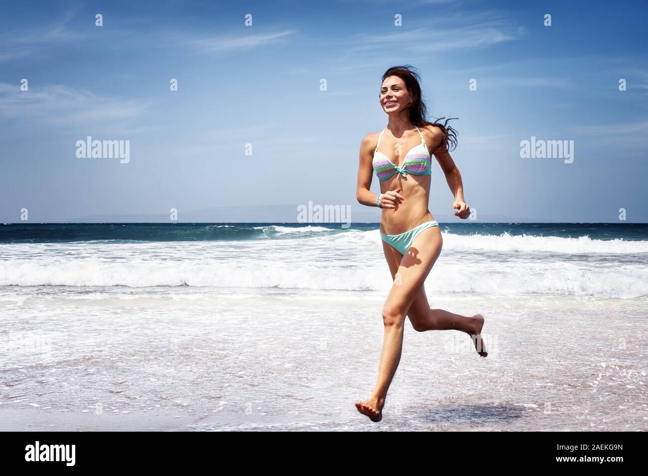 Woman Running On Beach