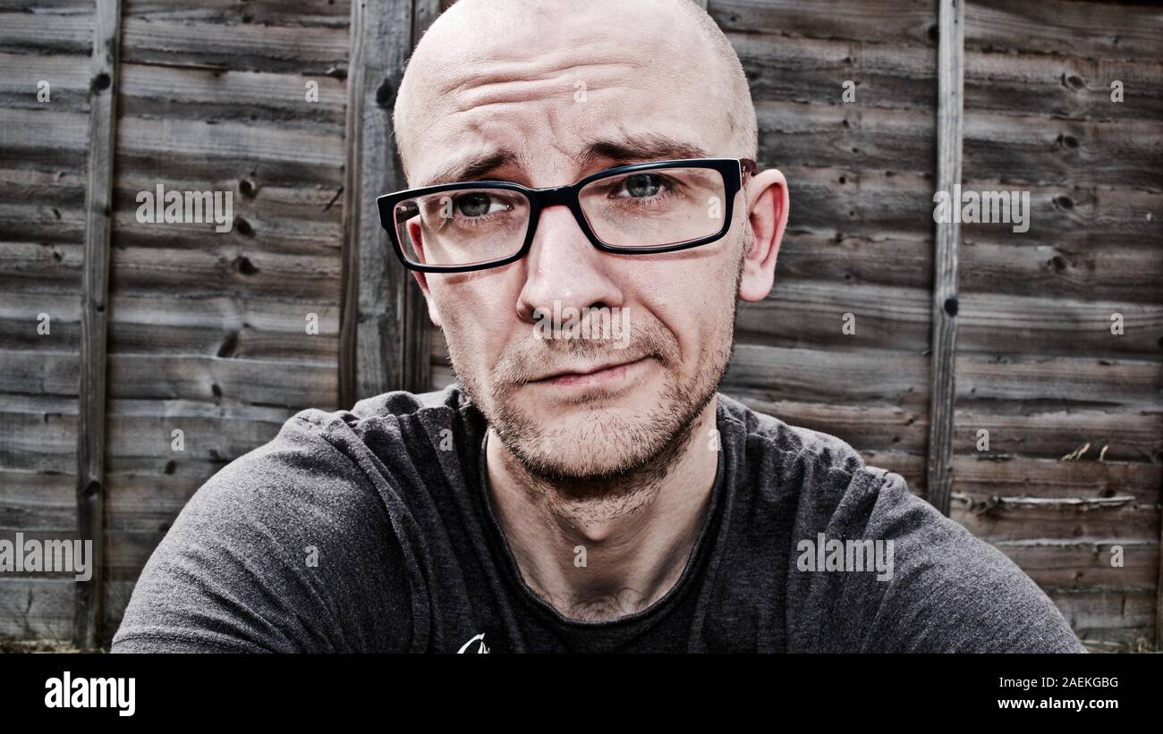 Critical looking man in glasses, Portrait Stock Photo - Alamy