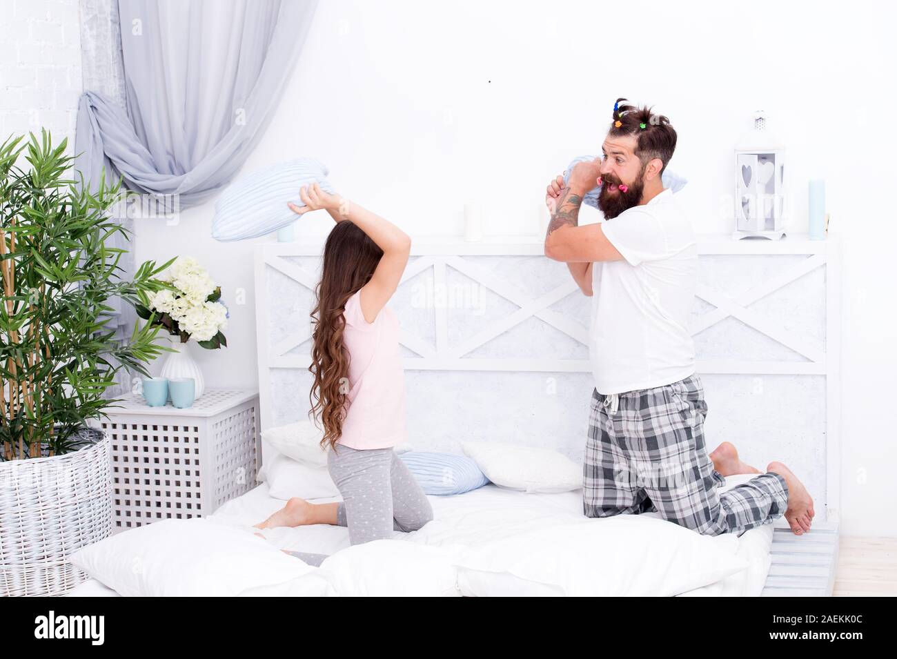 Upbringing happy daughter. Happy family. Role of father. Pillow fight ...