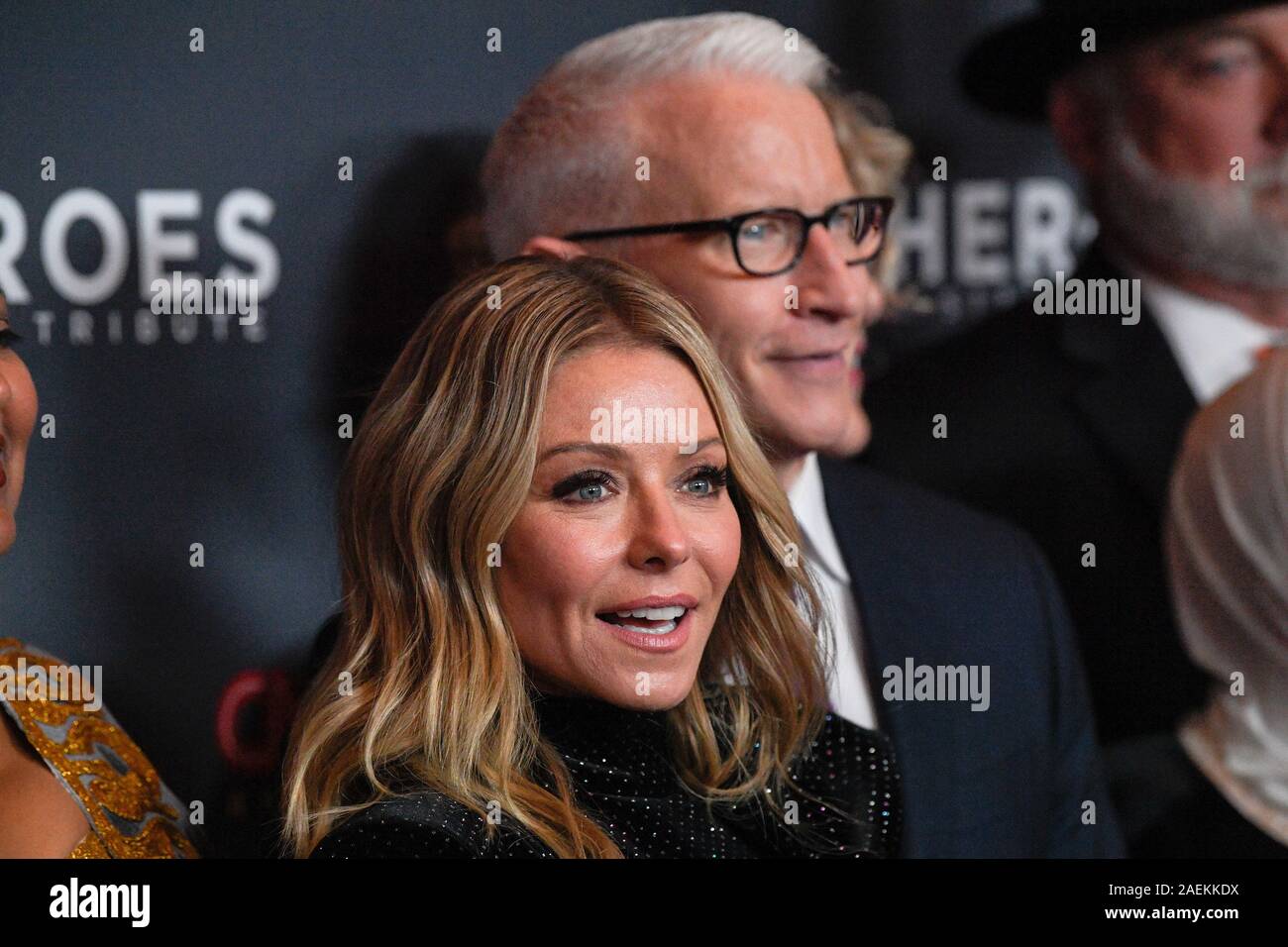 NEW YORK, NY - DECEMBER 08: Kelly Ripa and Anderson Cooper attend the ...