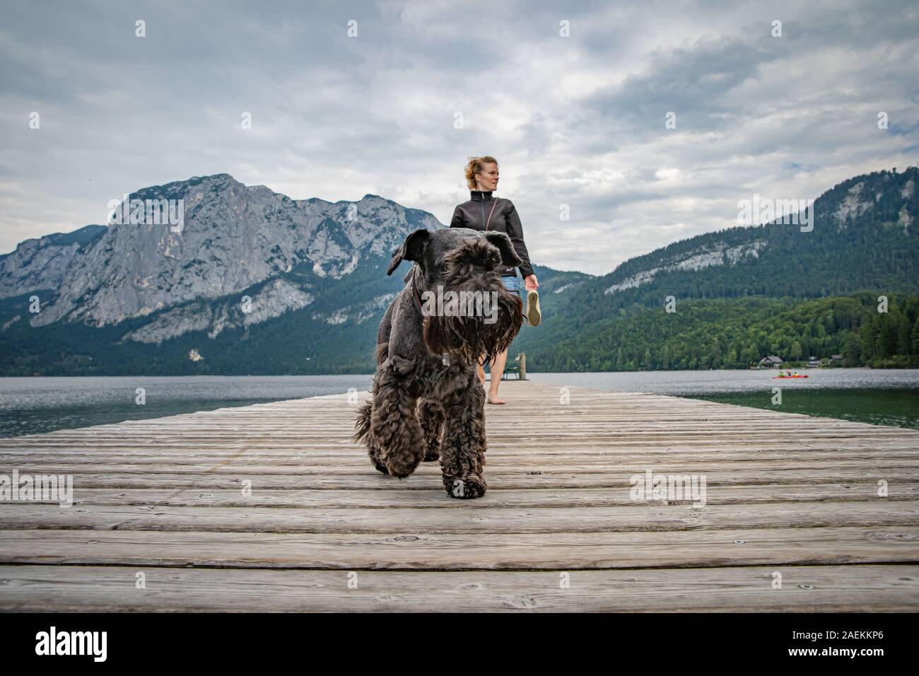 Woman and dog on pier hi-res stock photography and images - Alamy