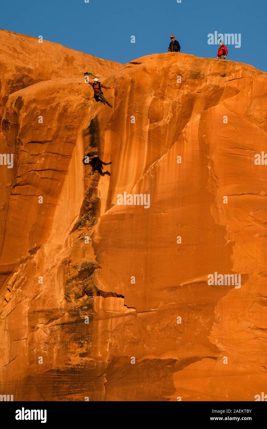 A BASE jumper leaps off the top of the 400 foot vertical face of the ...
