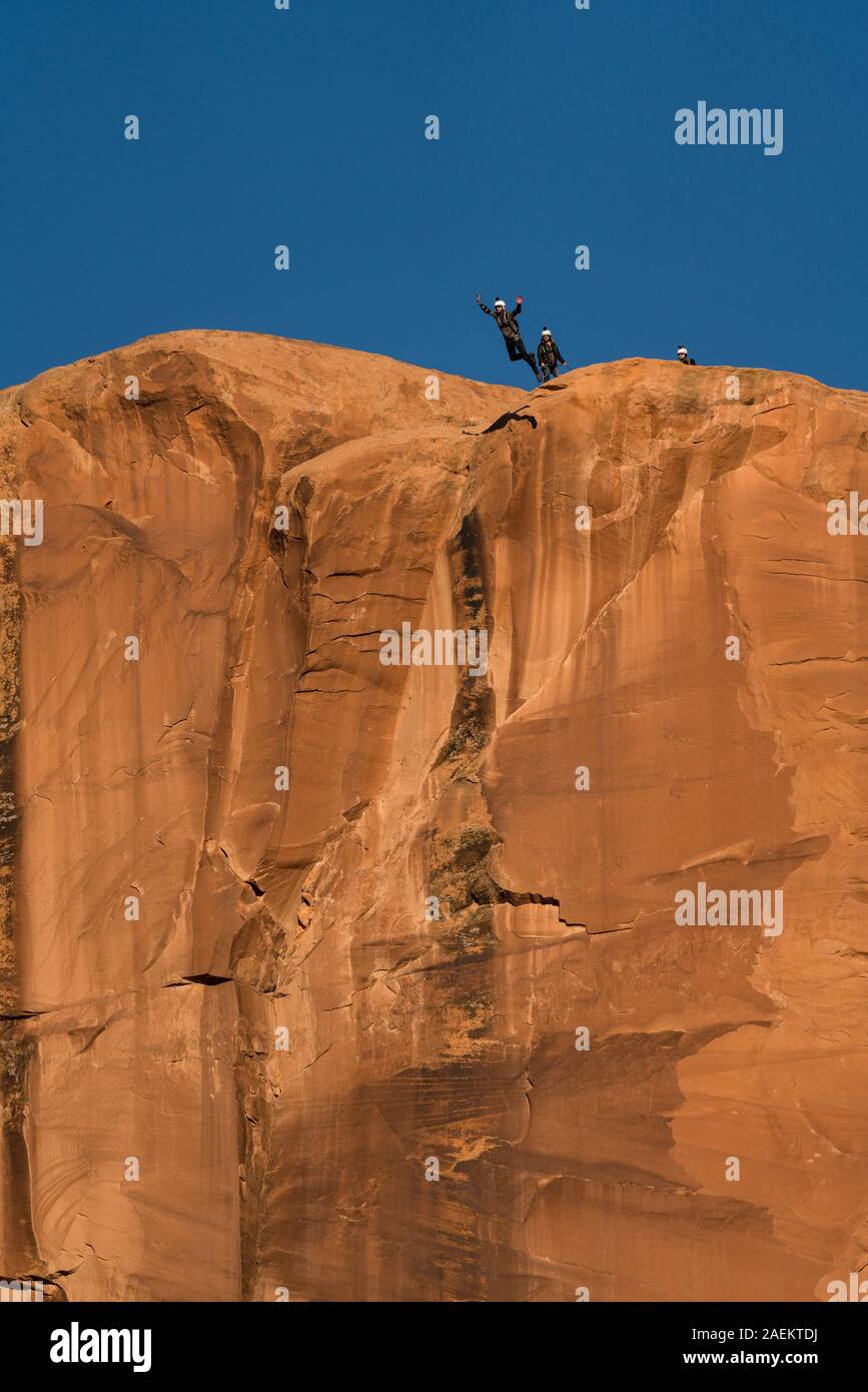 A BASE jumper leaps off the top of the 400 foot vertical face of the ...