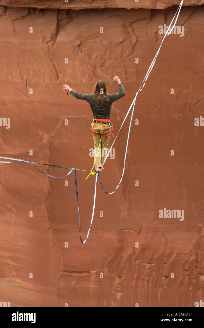 A young man slacklining or highlining hundreds of feet above Mineral ...