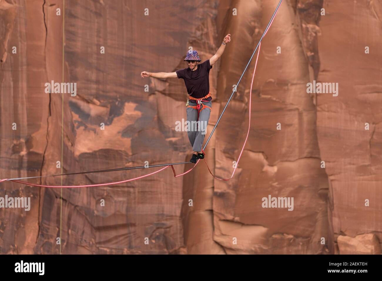 A young man slacklining or highlining hundreds of feet above Mineral ...