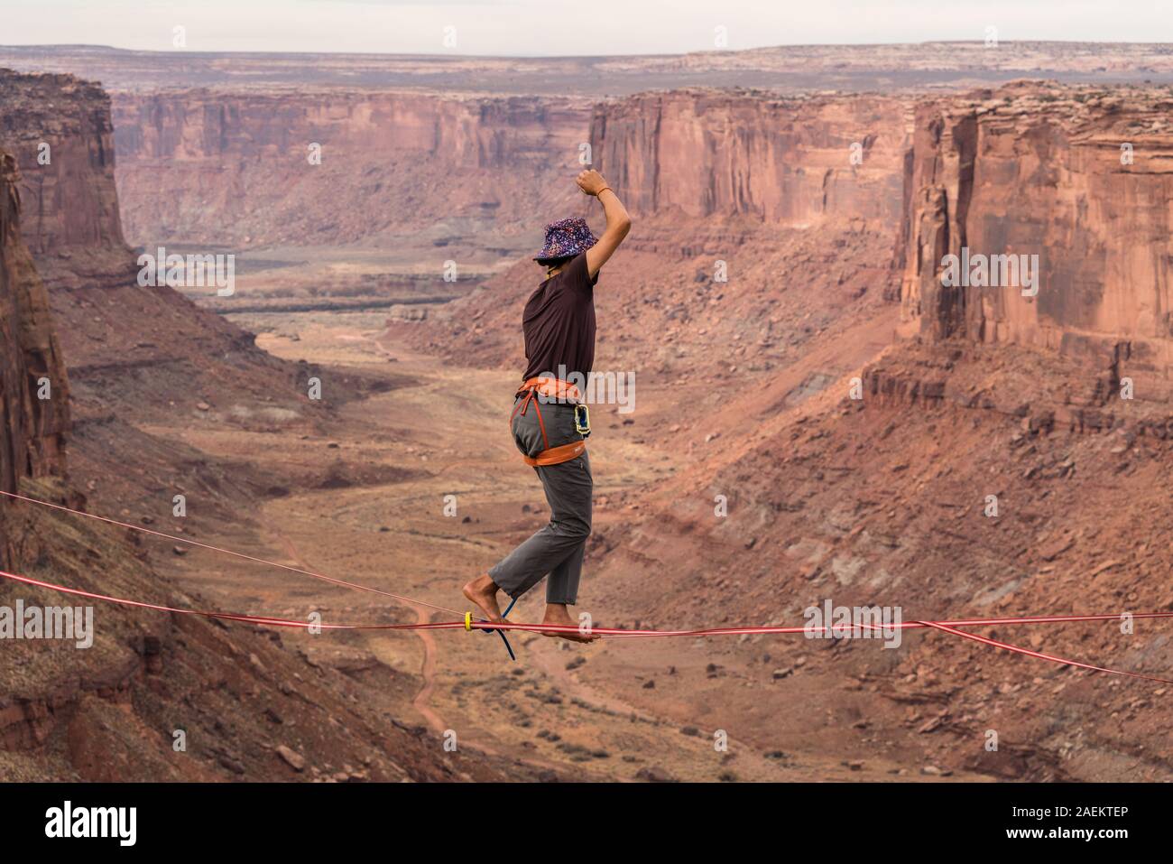 A young man slacklining or highlining hundreds of feet above Mineral ...