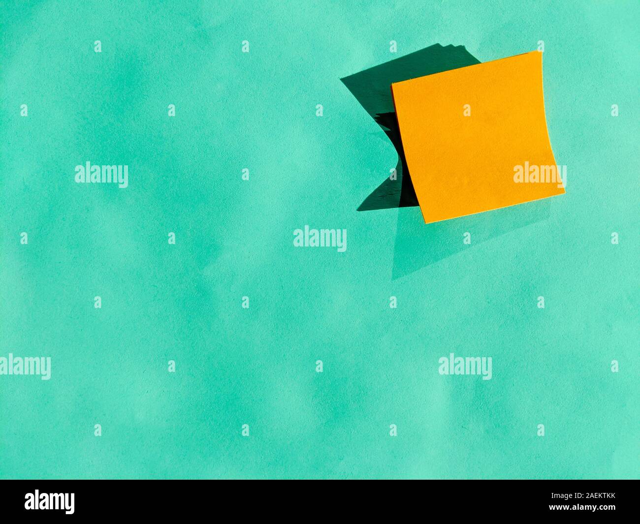 Orange Note Pad with Shadowing Against Soft Green Paper Background ...