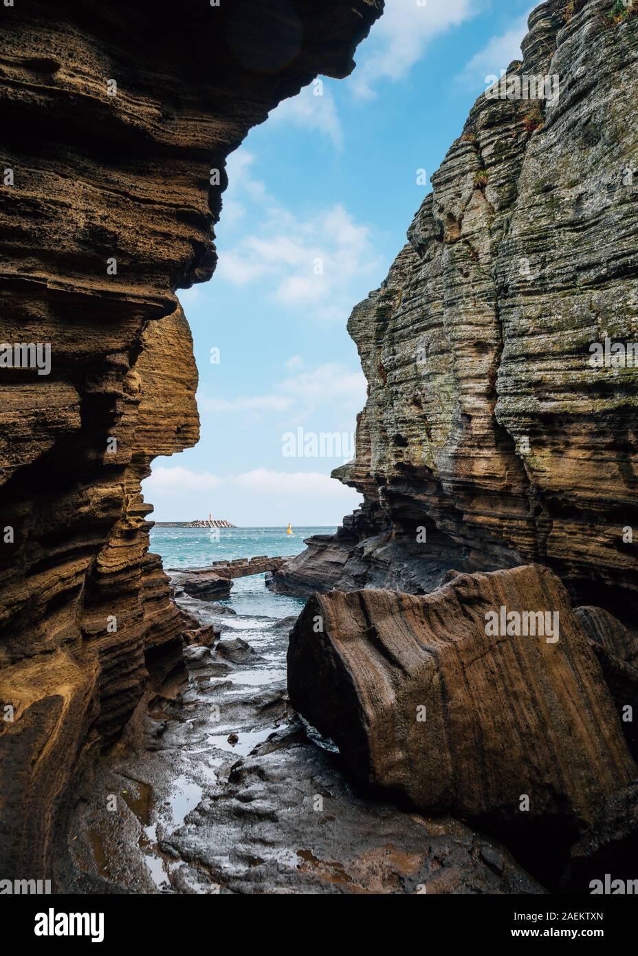 Yongmeori Beach sandstone cliff rock formation in Jeju Island, Korea ...