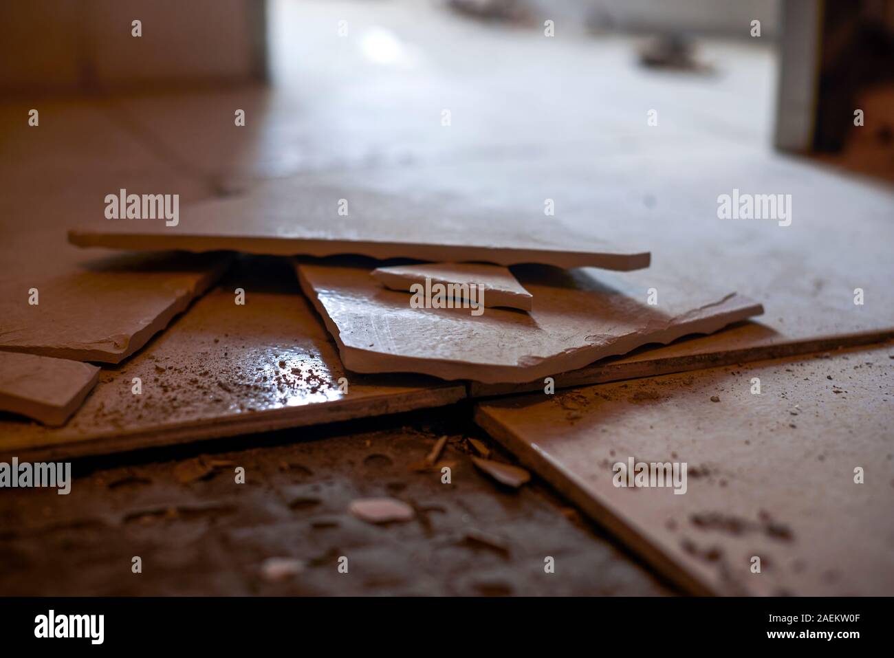 Broken and complete tiles when floor tiles are laid in a house ...