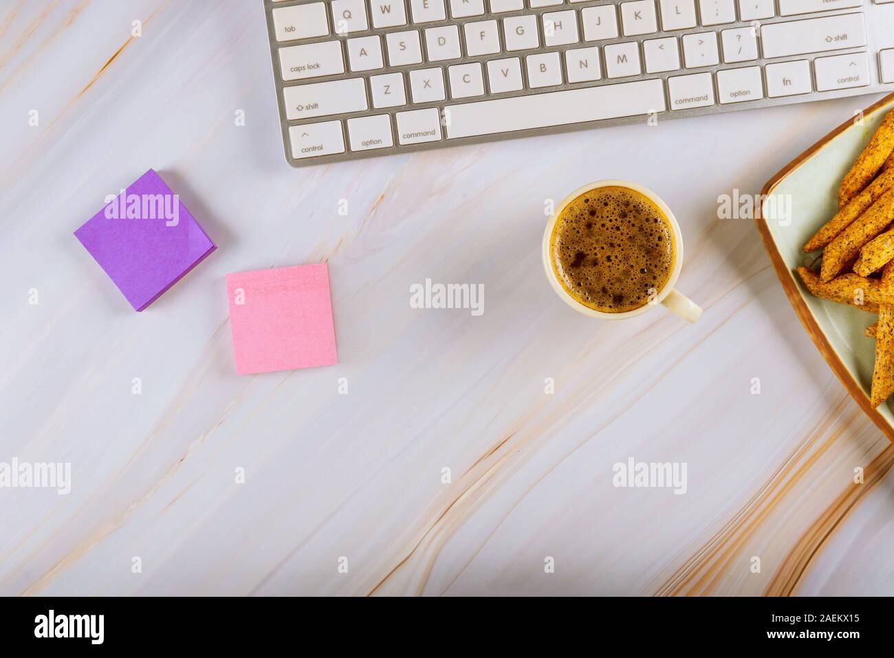 Tasty french fries with cup of coffee and computer keyboard on white ...