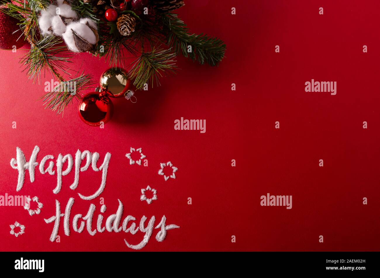 Christmas cheer on a red background Stock Photo - Alamy