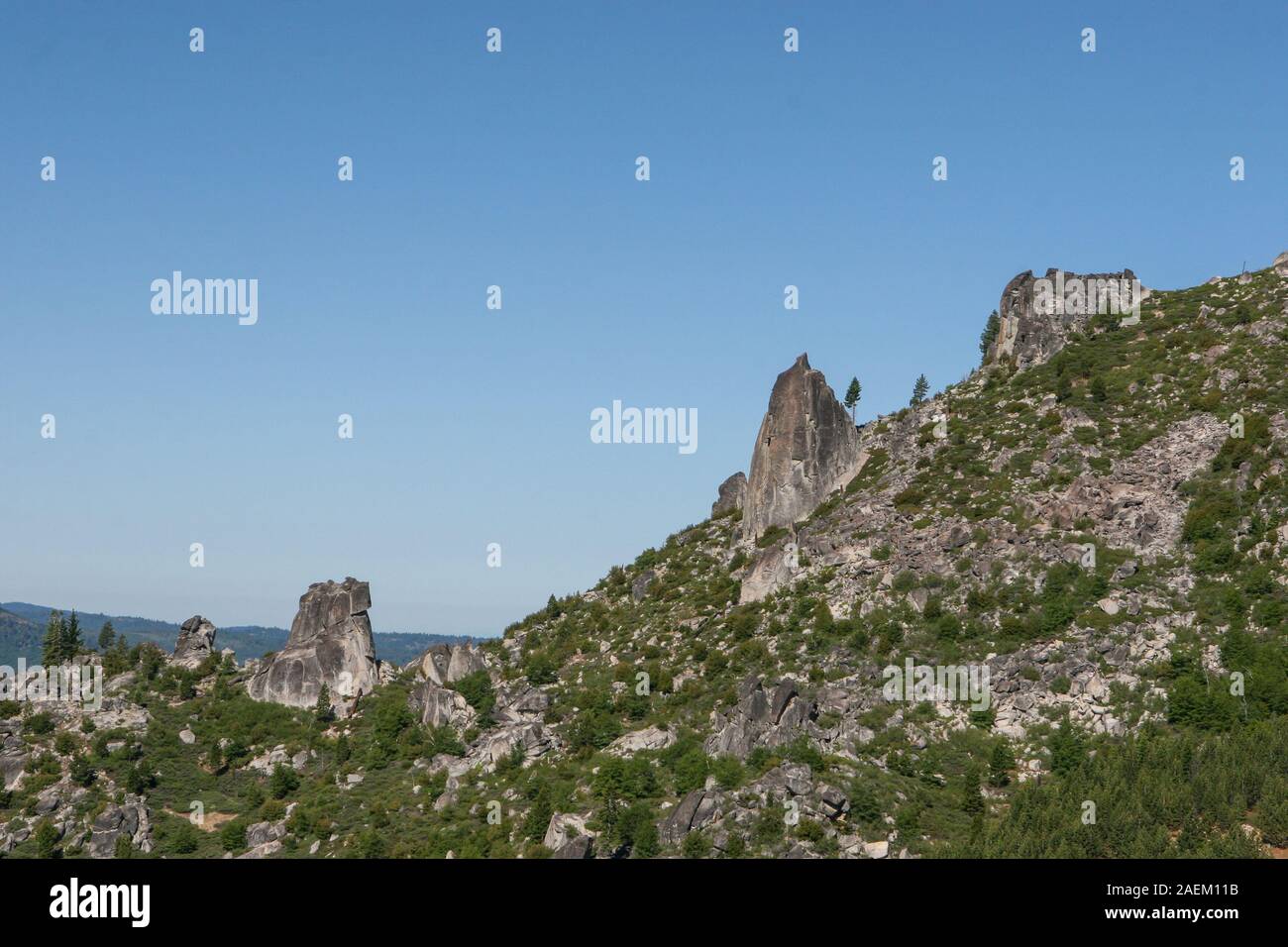 Large massive rocks and boulders litter a mountain side Stock Photo - Alamy